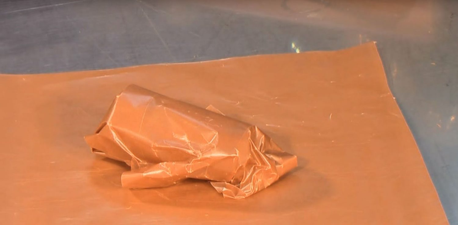 Paraffin-coated oiled paper for corrosion and moisture protection